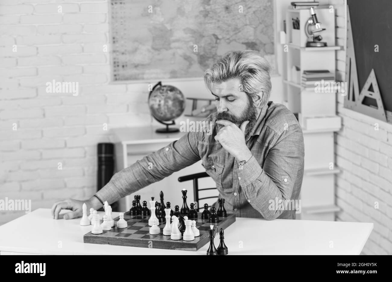 Looking for Tournament. moving pieces on chess board. man hold chess ...