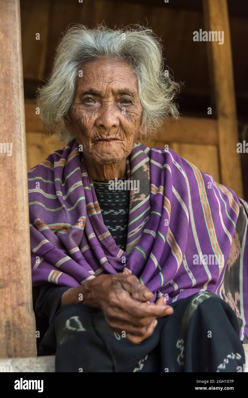 Portrait of a senior woman in the traditional village Luba. East Nusa ...