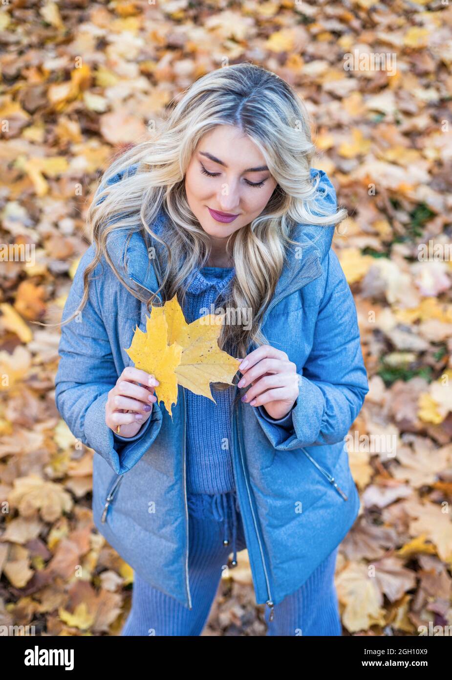 Time to relax. autumn fashion and beauty. pretty girl has long curly ...
