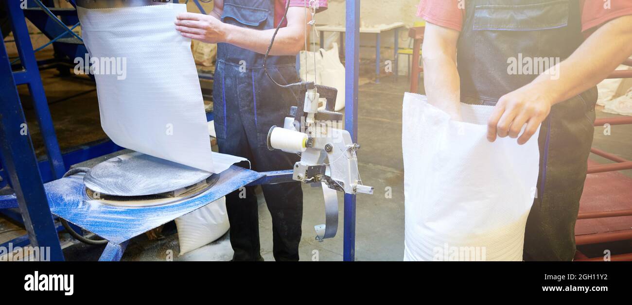 Sealing white plastic bag production line close up view Stock Photo - Alamy