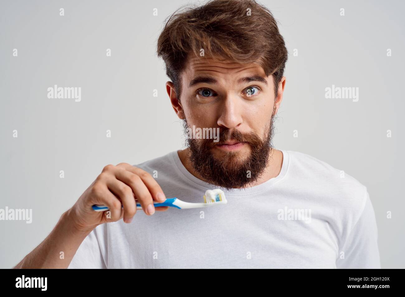 emotional man toothbrush in hand hygiene clean teeth isolated ...