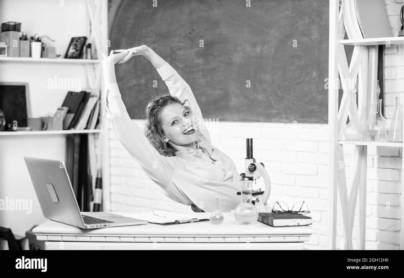 Stretching after hard working day. Teacher adorable woman try to relax ...