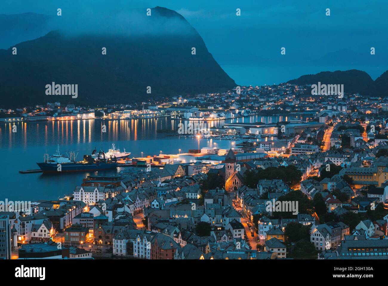 Alesund, Norway. Night View Of Alesund Skyline Cityscape. Historical ...