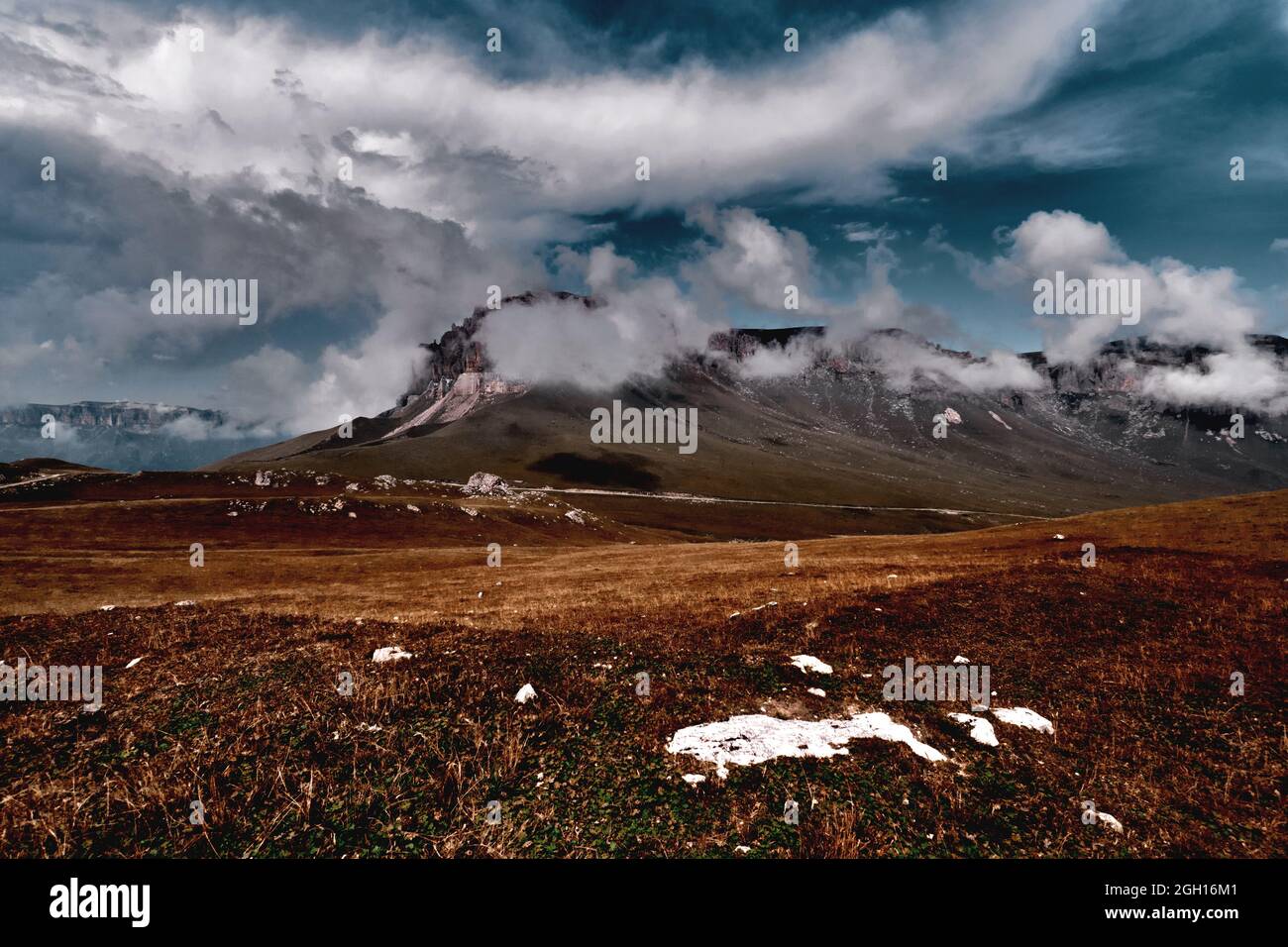Dramatic sky and landscape image surrounding rock mountain and valley ...
