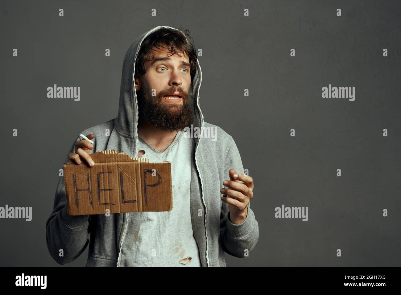 Bearded homeless man holding hi-res stock photography and images - Alamy