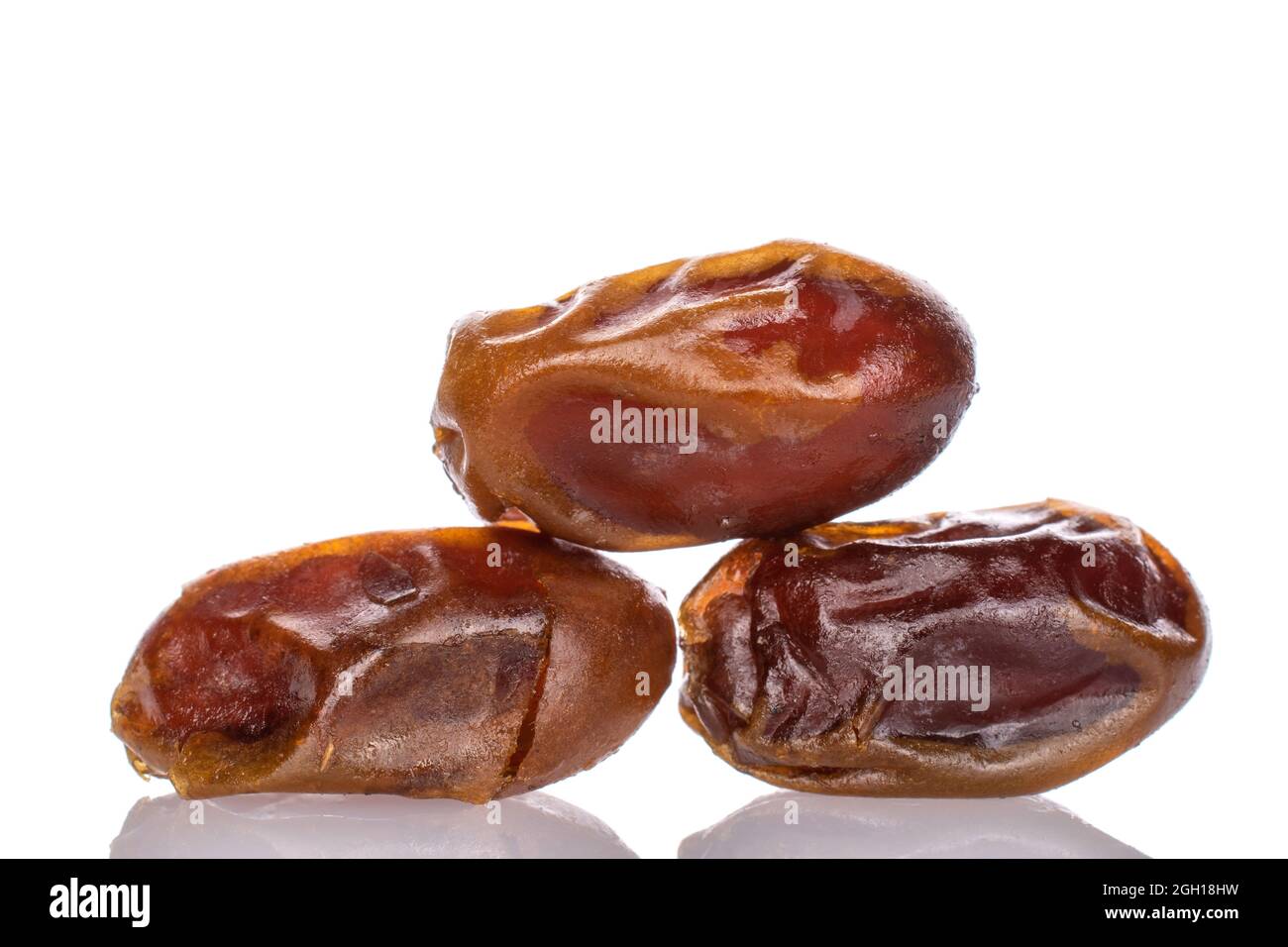 Three natural dried dates, close-up, isolated on white Stock Photo - Alamy