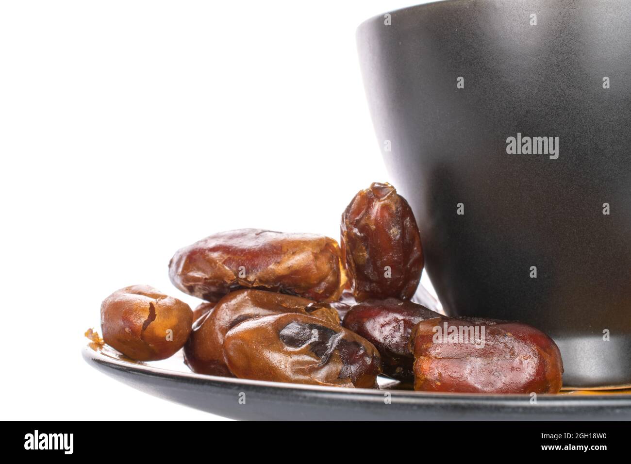 Cup of dates on white hi-res stock photography and images - Alamy