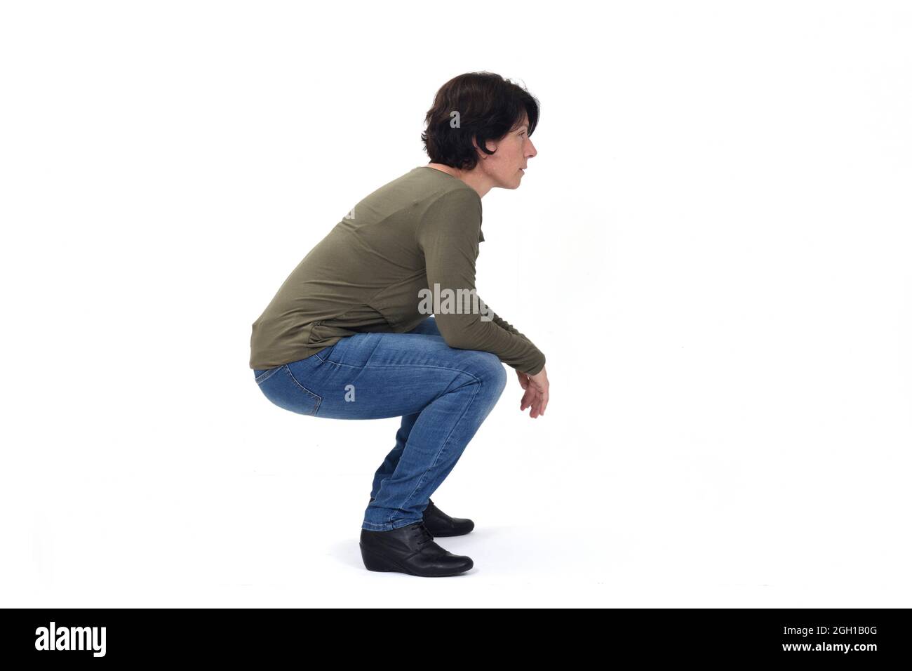 Squatting on the floor Cut Out Stock Images & Pictures - Alamy