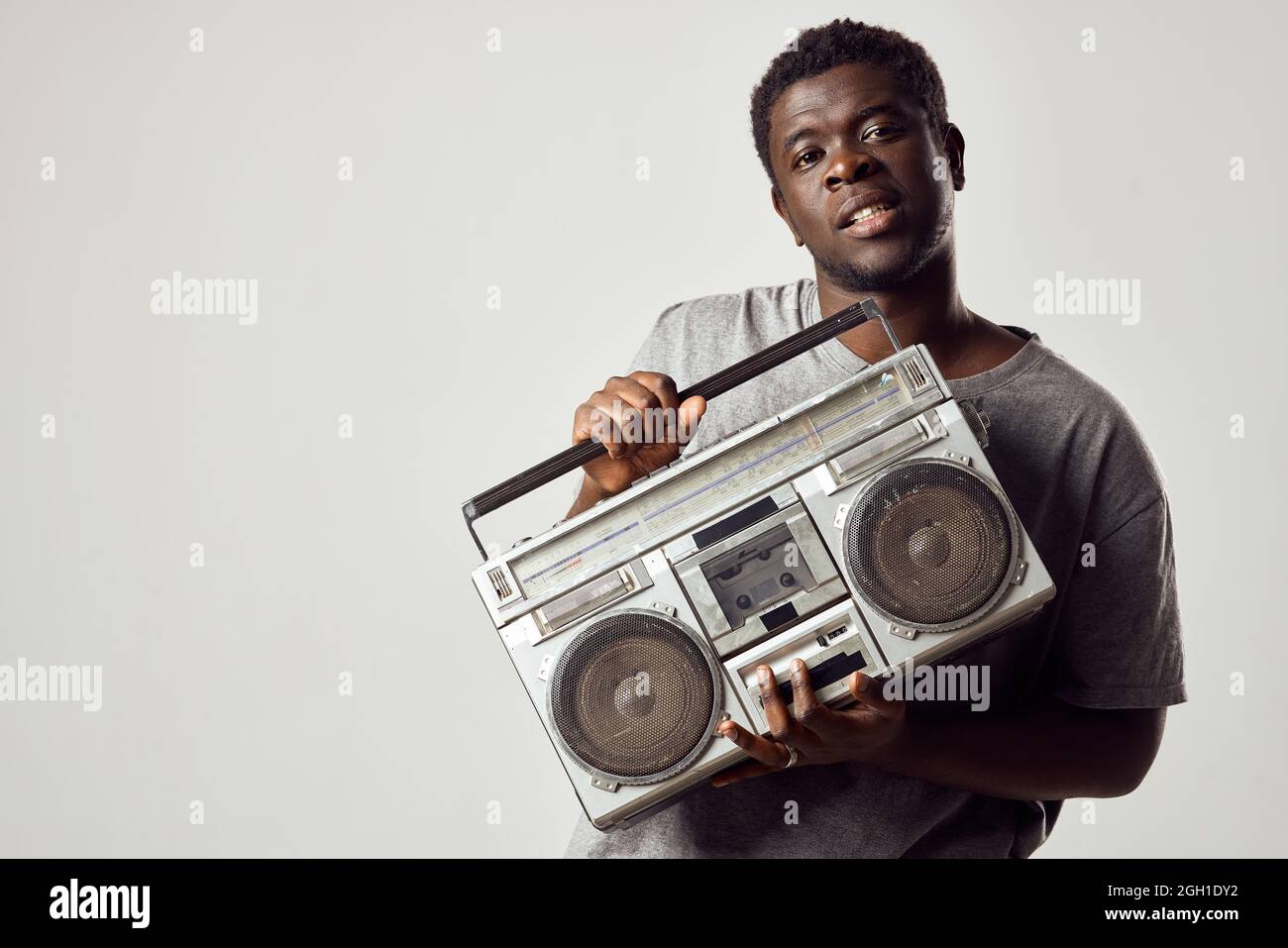 man with a tape recorder in his hands listening to music african ...