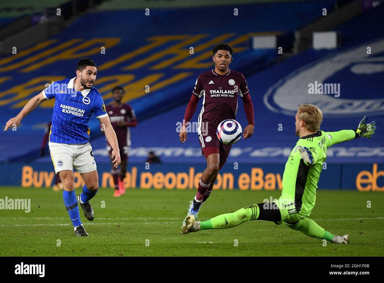 Neal Maupay of Brighton & Hove Albion in action with Kasper Schmeichel ...