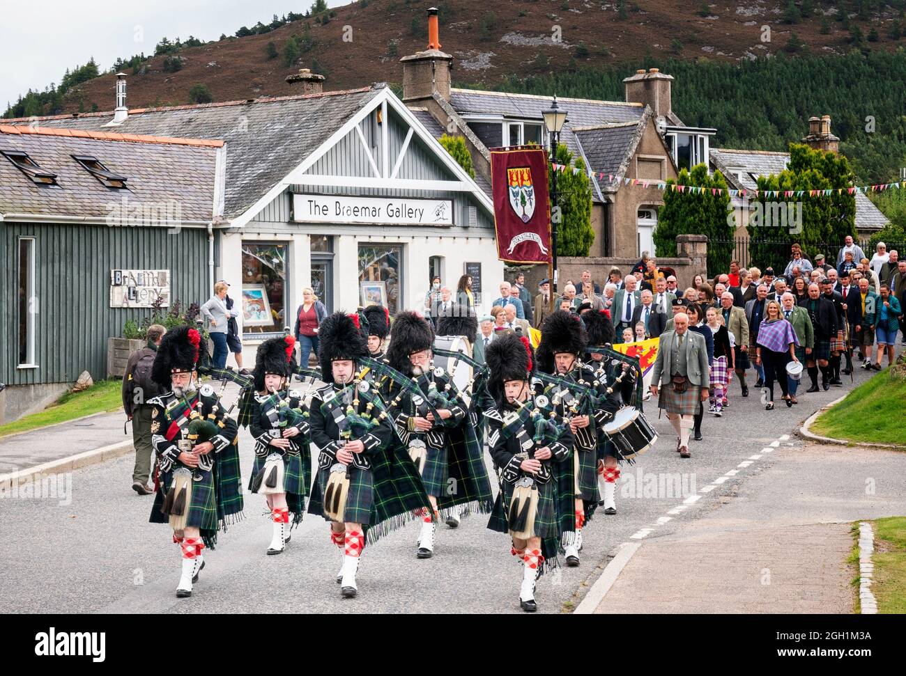 The Lonach Pipe Band march through the village during the 'Gathering ...