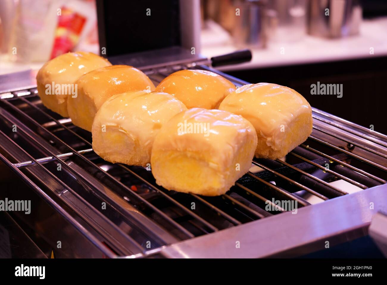 Custard bread on iron stove and blur background Stock Photo - Alamy