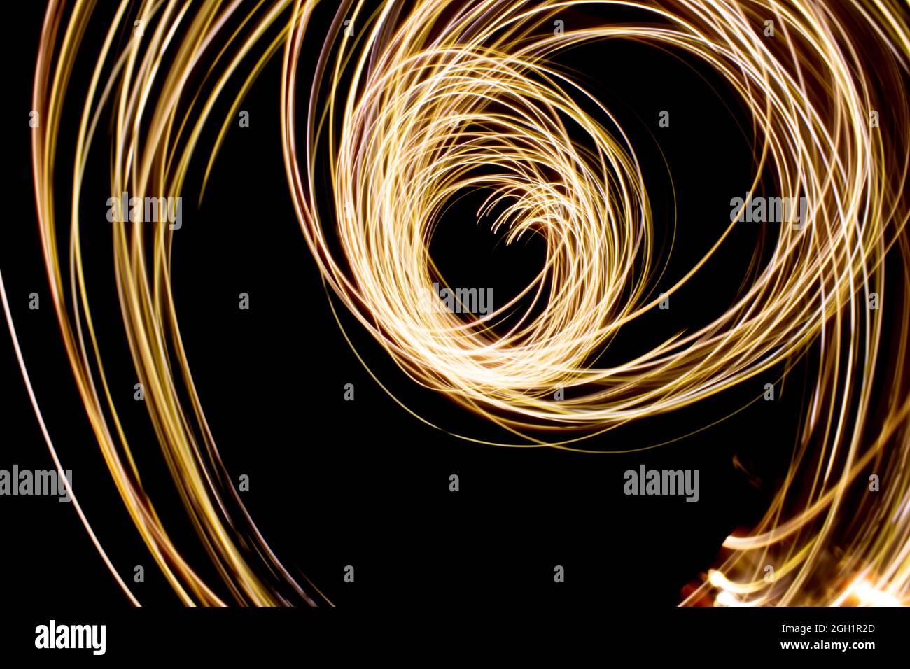 Neon yellow gold abstract swirl, light painting yellow pattern against ...