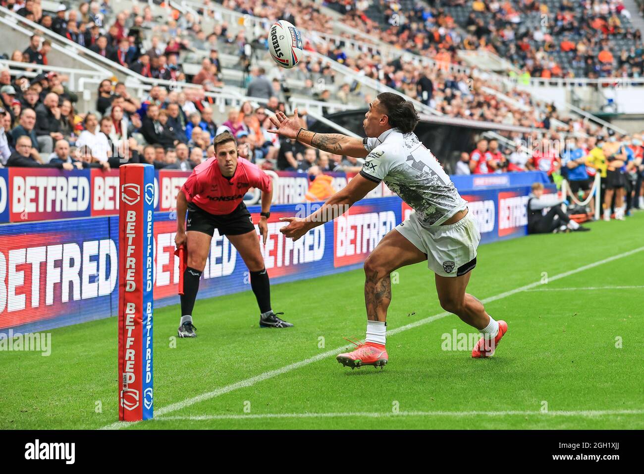 Ken Sio (2) of Salford Red Devils fumbles the ball in front of the try ...