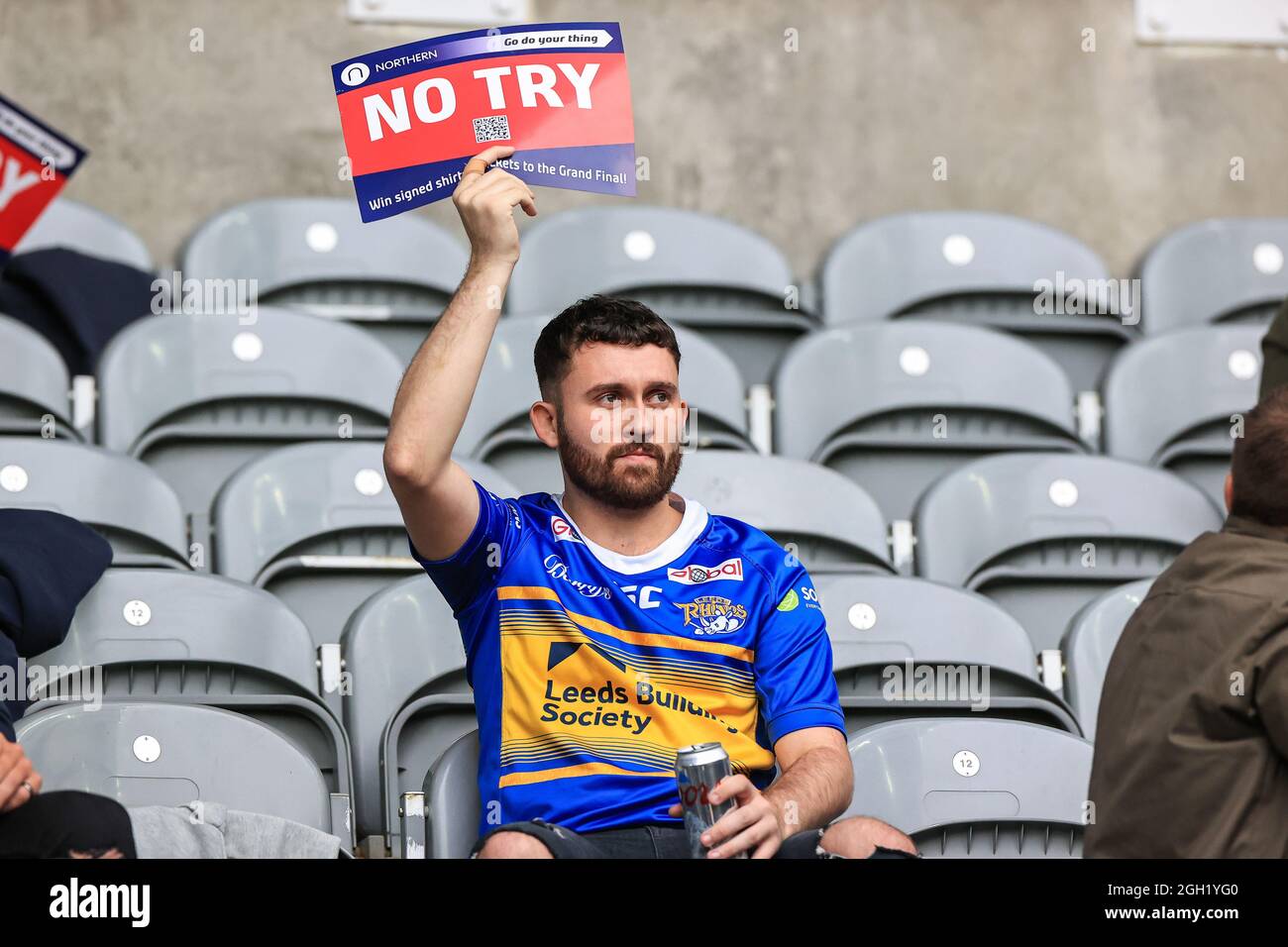 A Leeds fan hold up the no try sign as Castleford Tigers go over for a ...