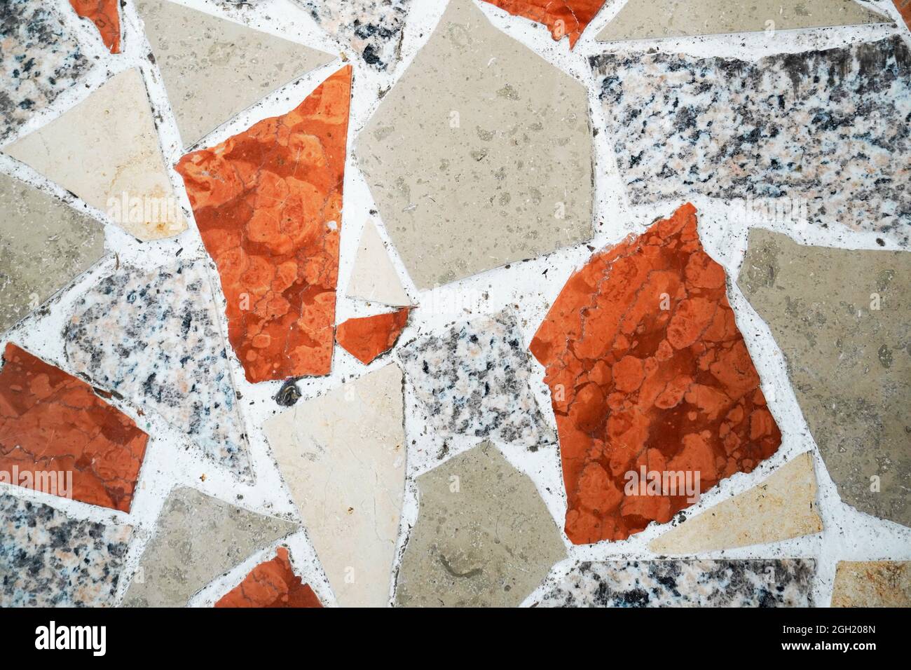 Mosaic floor, composed of different types of stone. Stone background ...