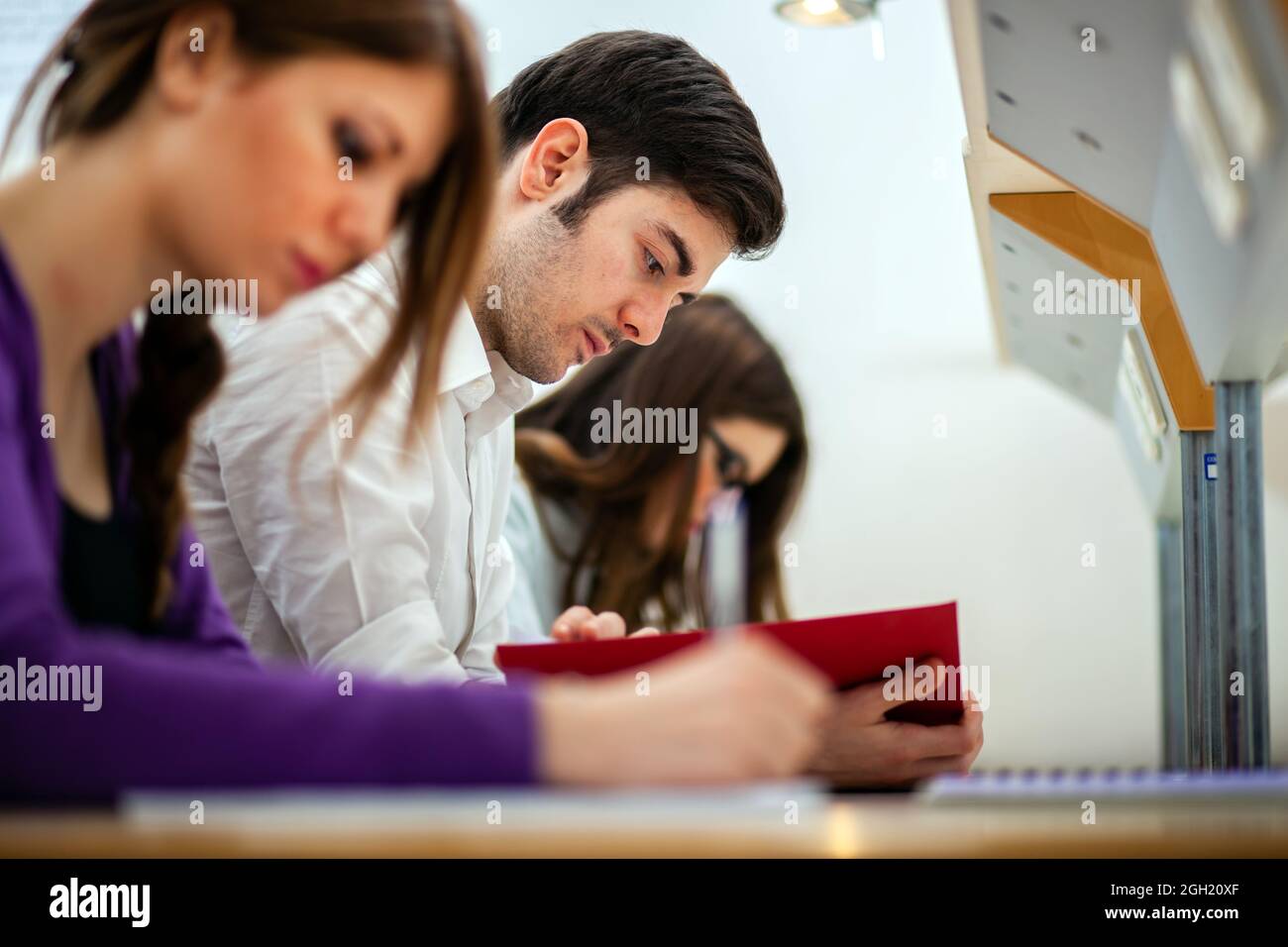 Students studying in a library Stock Photo - Alamy