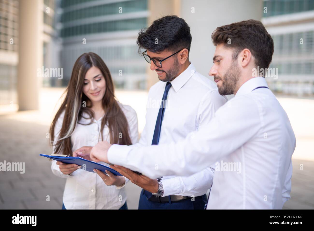 Group of business people speaking out of their office, teamwork concept ...