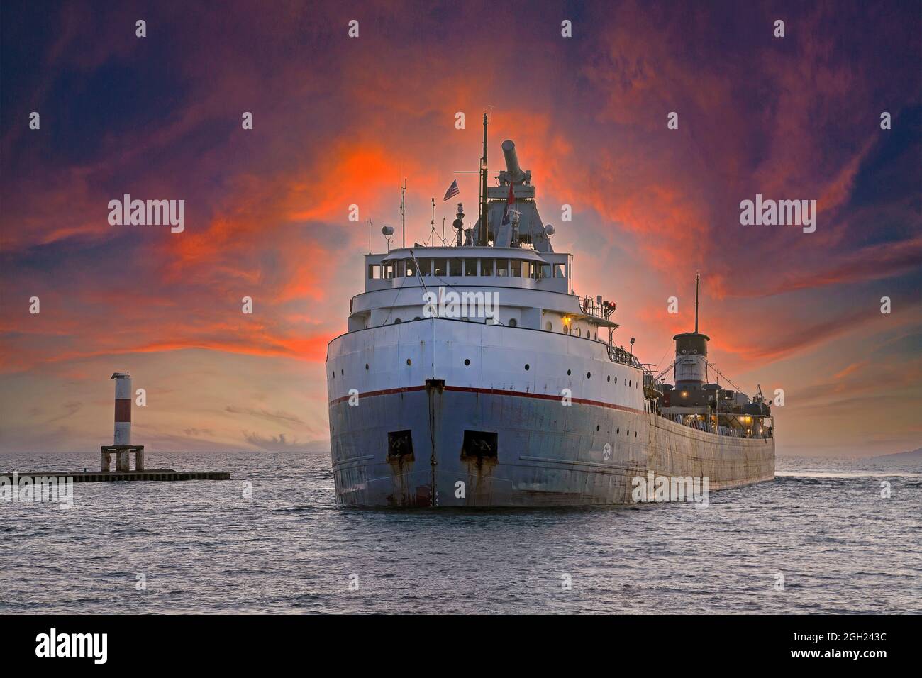 Large freighter entering a Holland Michigan harbor at sunset time Stock ...