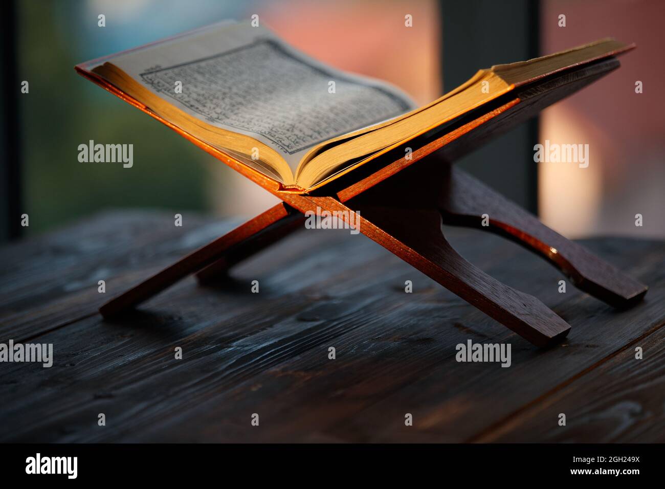 Koran Islamic sacred book on traditional Muslim style wooden stand with ...