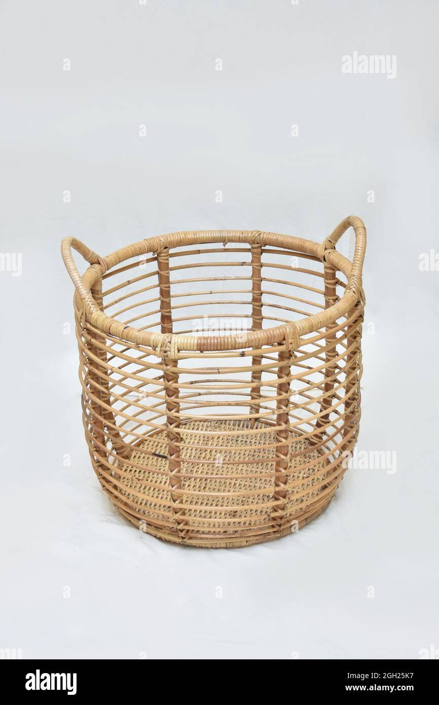 cane rattan Landry basket set on white background selective soft focus ...