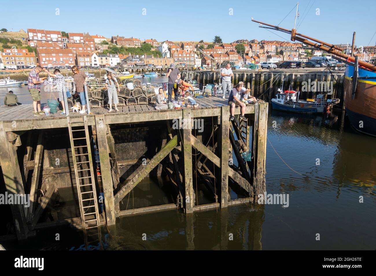 families crabbing in Whitby, North Yorkshire, UK Stock Photo - Alamy