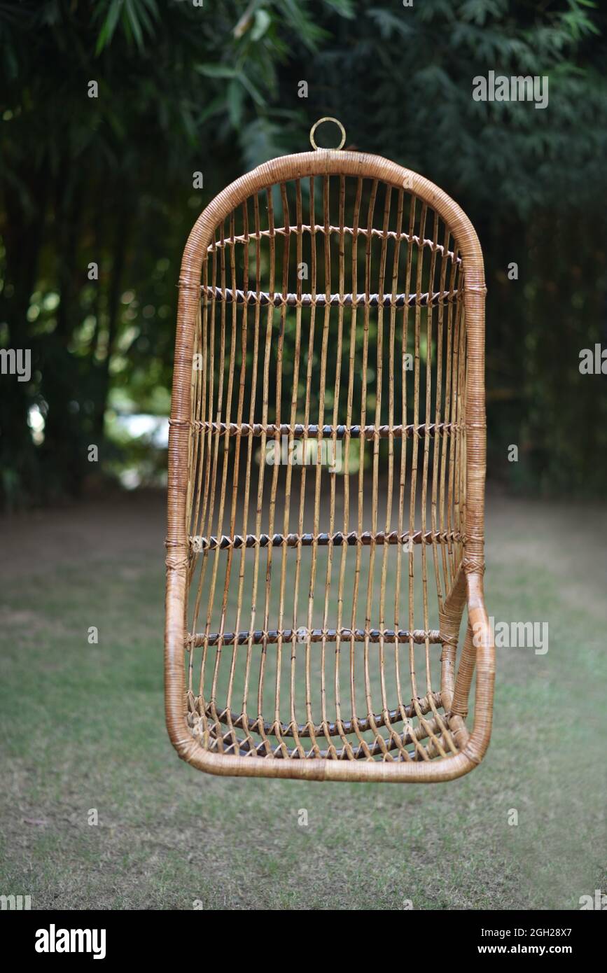 Wooden swing chair with cousins outdoor background Stock Photo - Alamy
