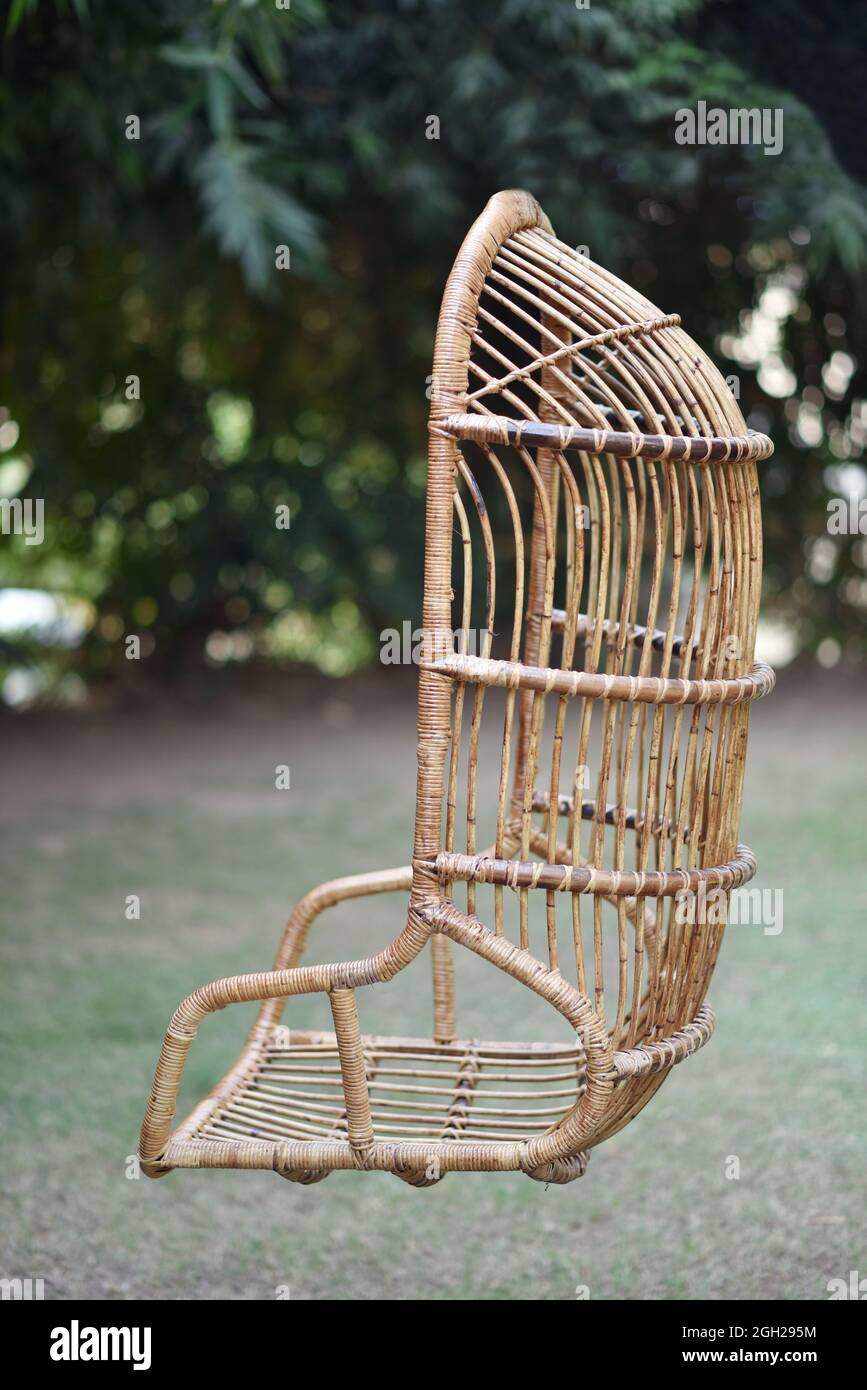 Wooden swing chair with cousins outdoor background Stock Photo - Alamy