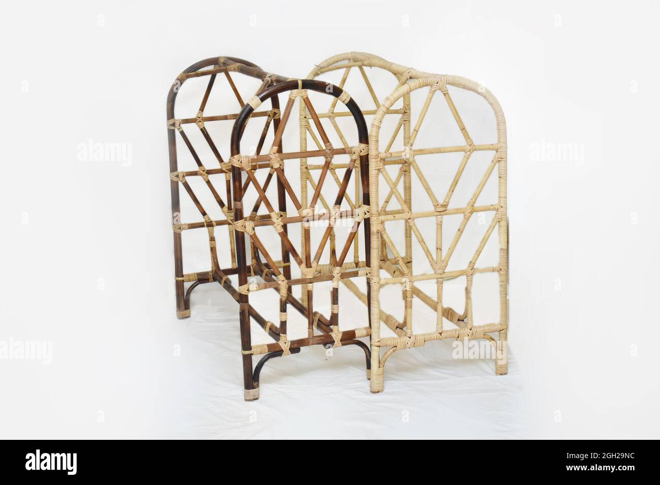 rattan cane kids clothes rack with white background and selective focus ...