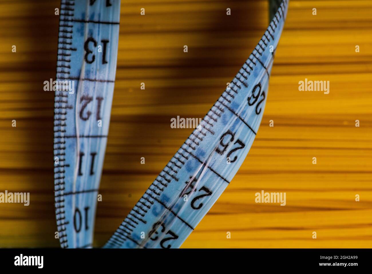 Spaghetti with measuring tape hi-res stock photography and images - Alamy