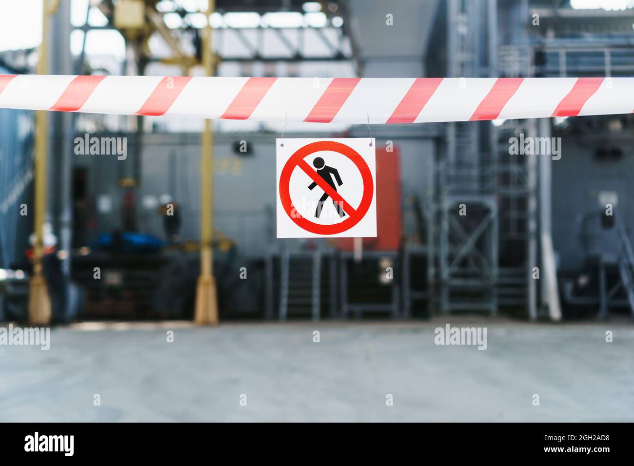 Unauthorized entry is prohibited the poster hangs on a red and white ...