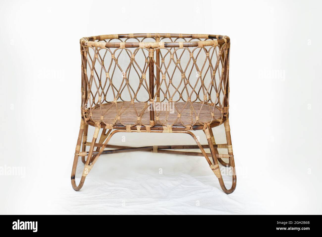 cane baby cot on white background selective soft focus Stock Photo - Alamy