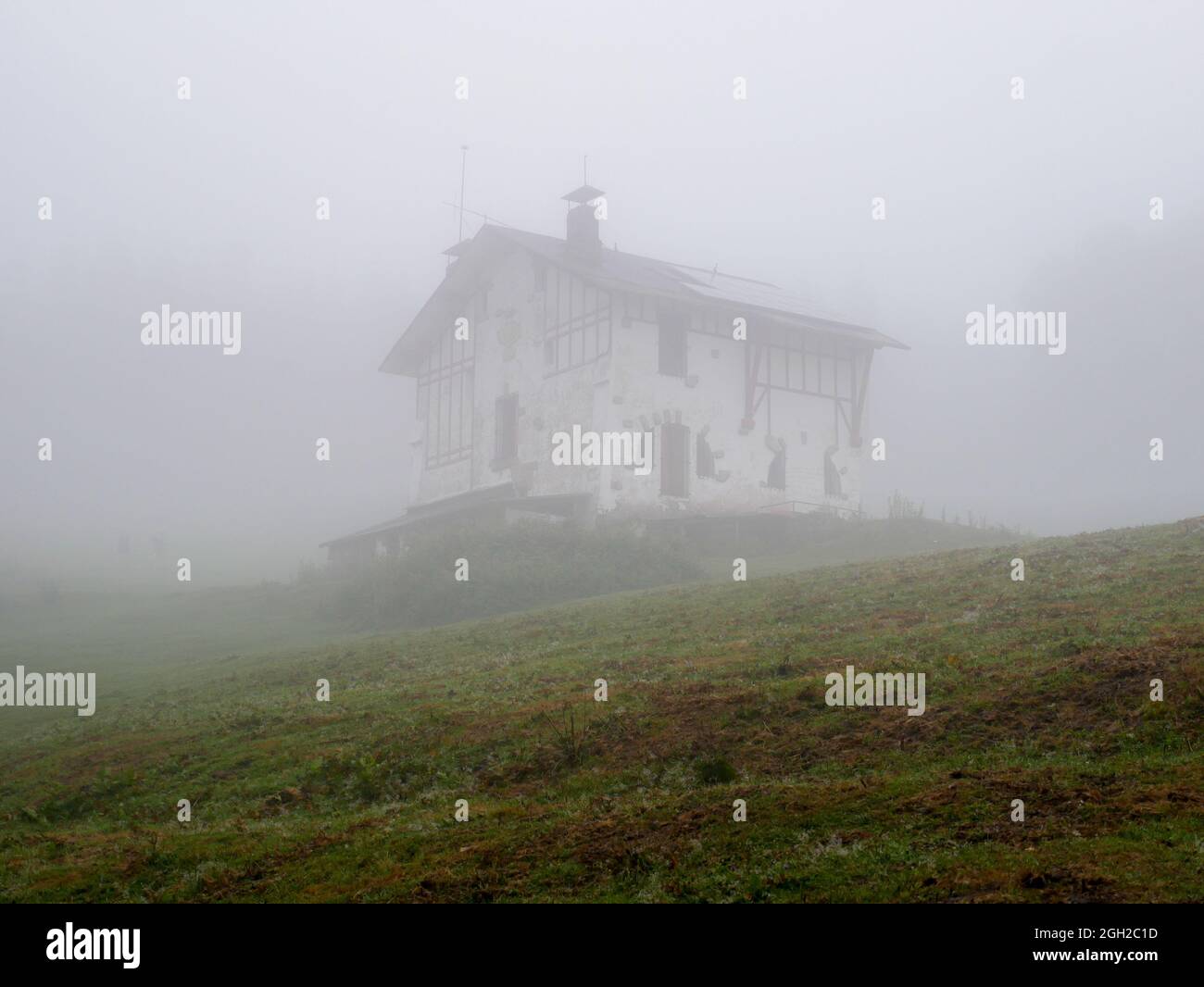 Old mysterious house visible through the dense fog Stock Photo - Alamy
