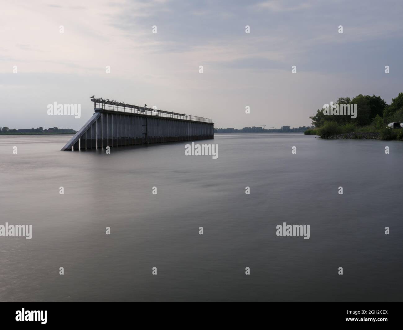 Dam support barrier on the water surface Stock Photo - Alamy