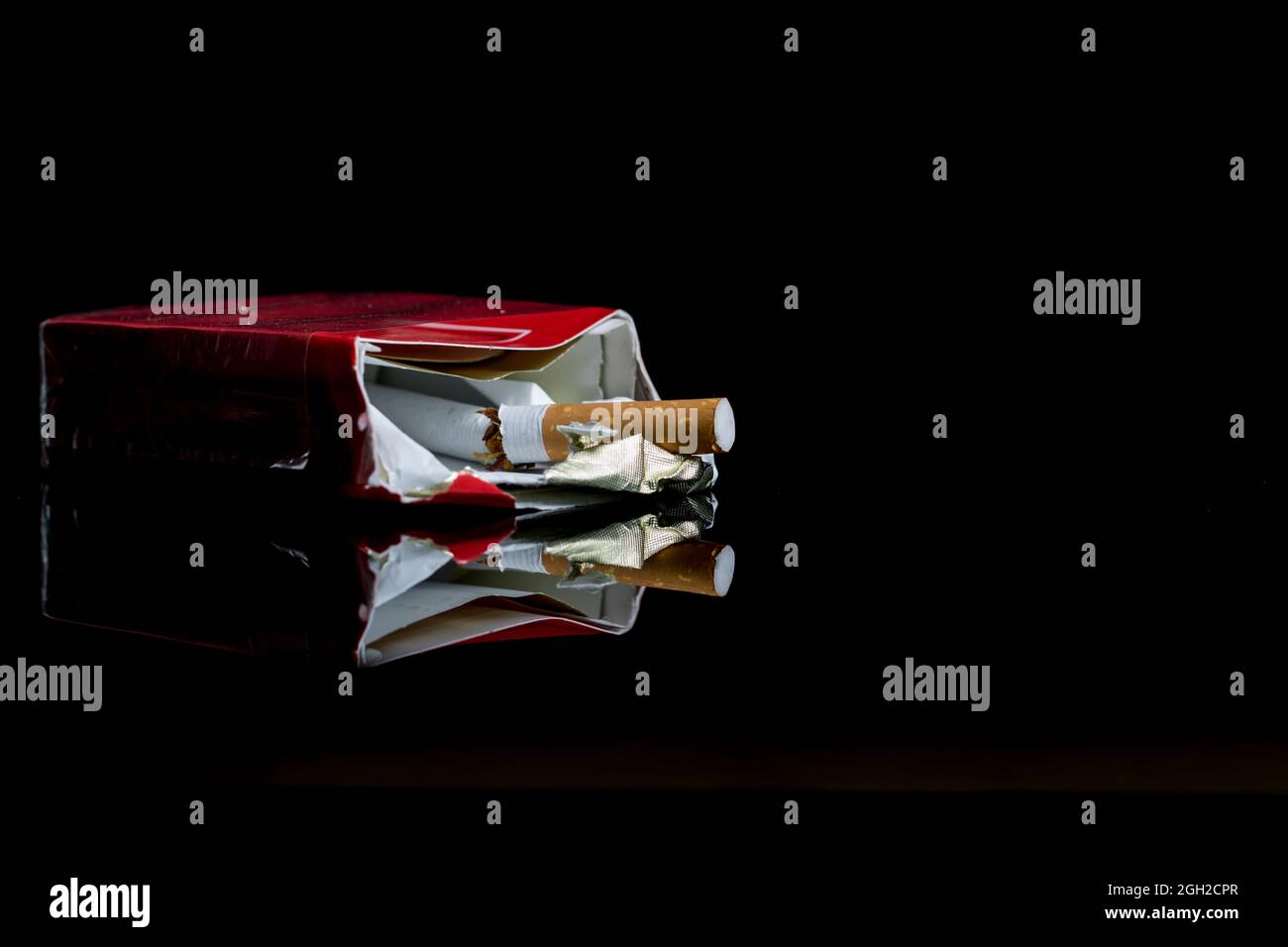 Cigarette package close up with broken cigarette. Smoking concept ...