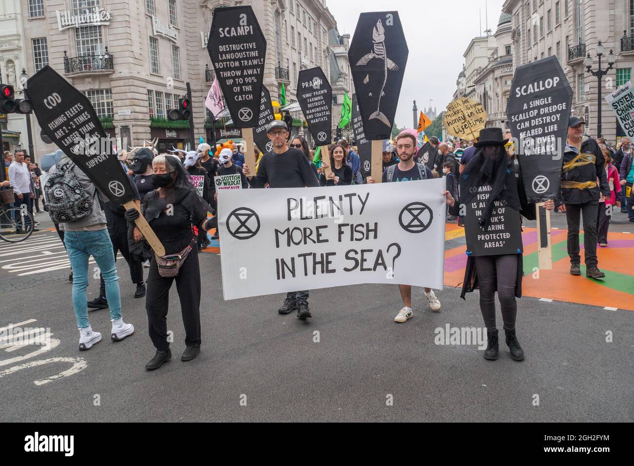 London, UK. Sep 4th 2021. Marchers with coffin-shaped placards against ...