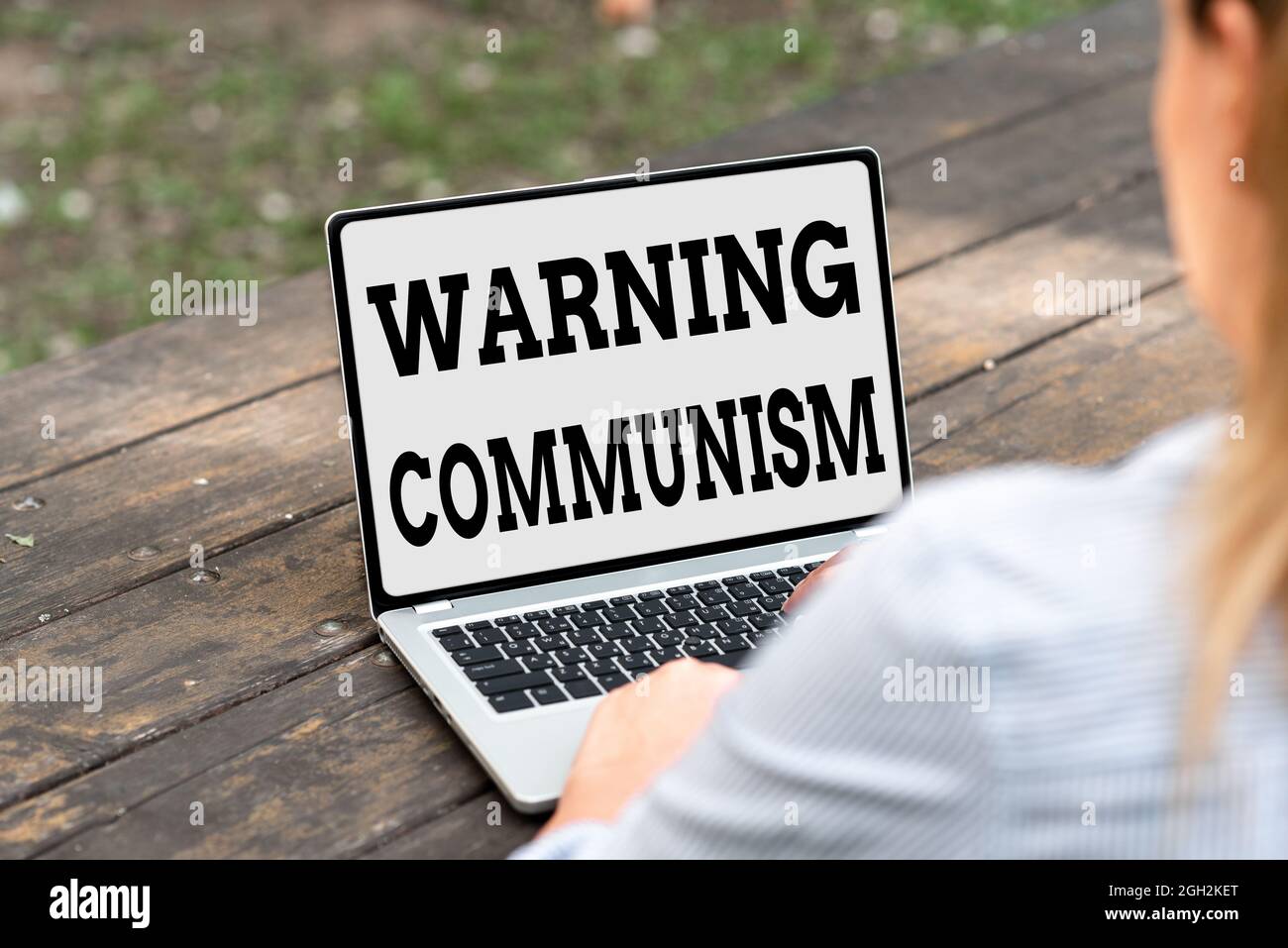 Sign displaying Warning Communism. Word for economic system where the ...