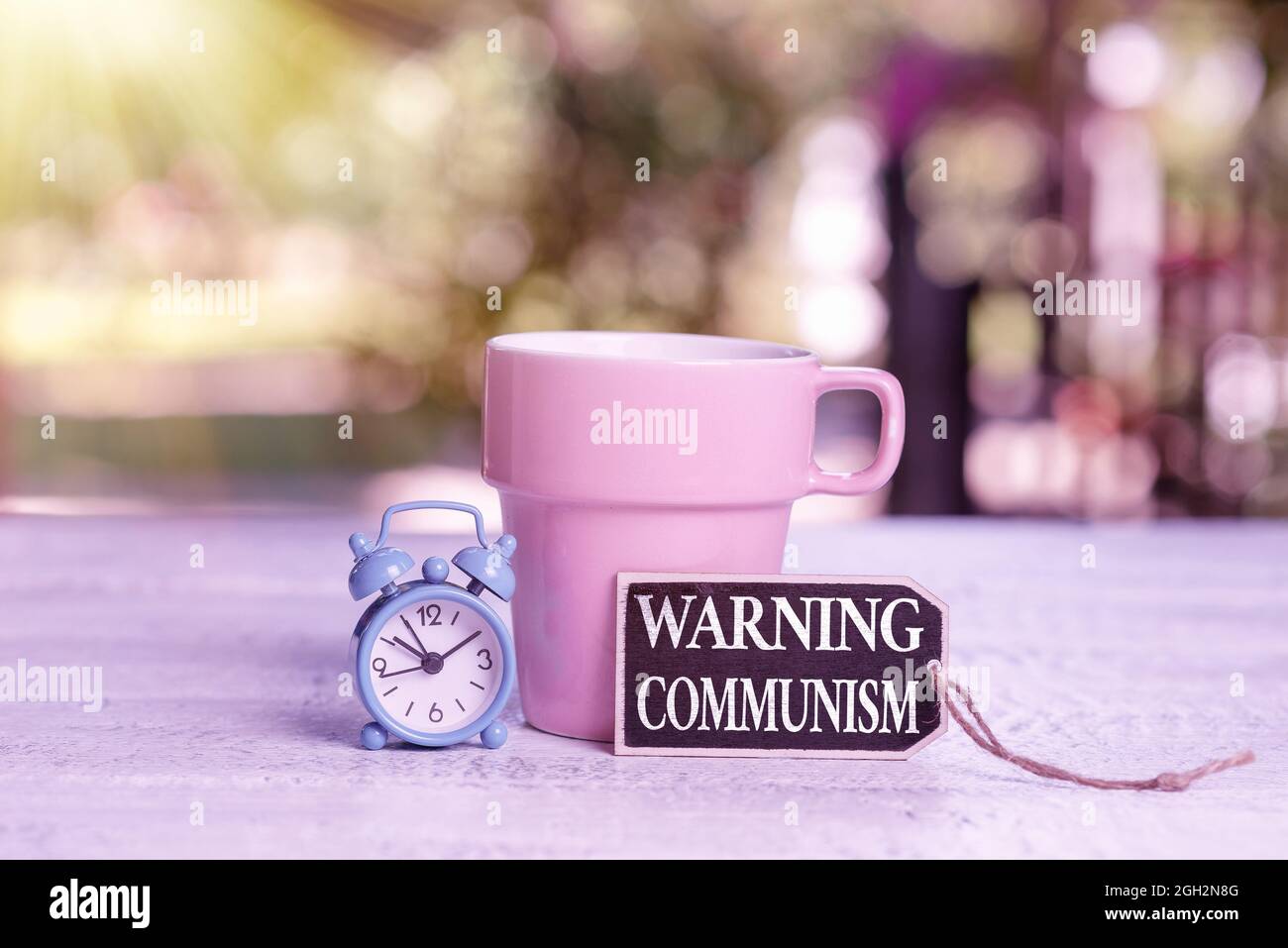 Hand writing sign Warning Communism. Business showcase economic system ...