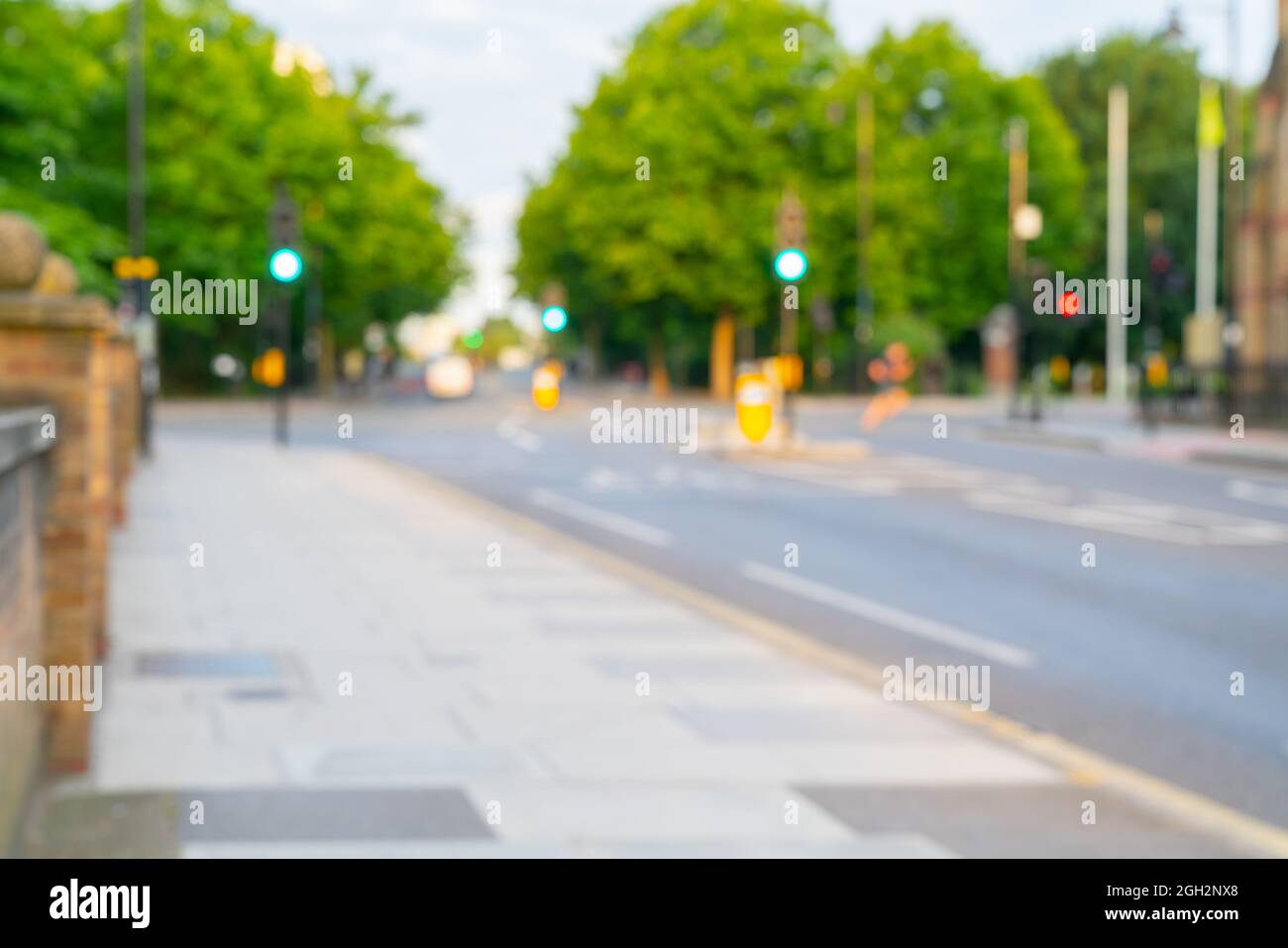 Defocused urban street background with traffic control lights at ...