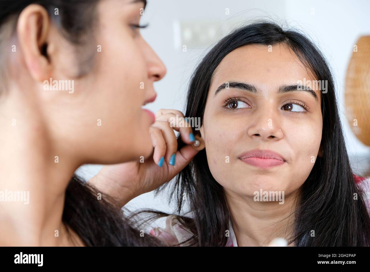 Young Indian girls having a discussion at home Stock Photo - Alamy