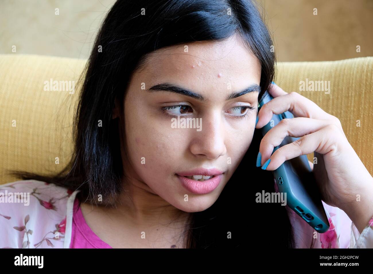 Young Indian girl talking on the phone at home Stock Photo - Alamy