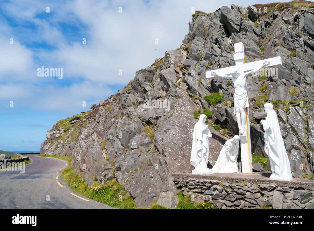 Crucifixion religious scene in statues on ledge beside windy part of ...