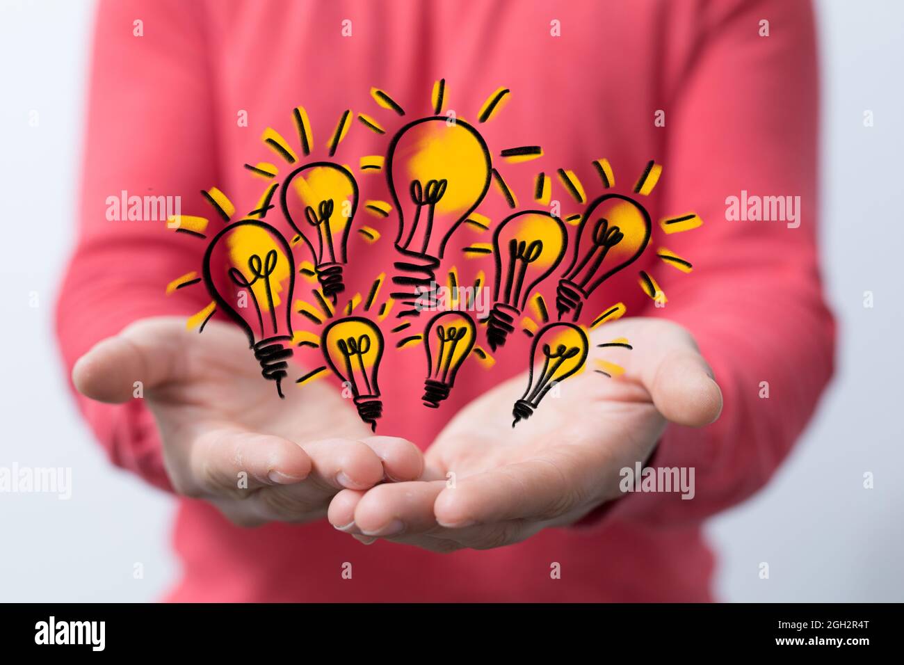 Illustration of lamps as idea icons in hands Stock Photo - Alamy