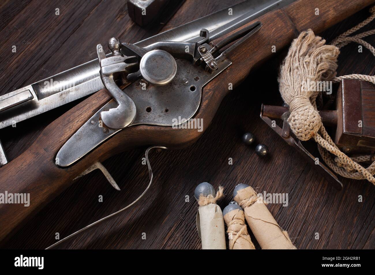 17th century ancient flintlock musket with powder flask and led bullets ...