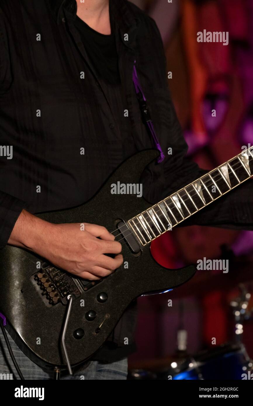 Detail of a person's hand playing an electric guitar. Tab for electric ...