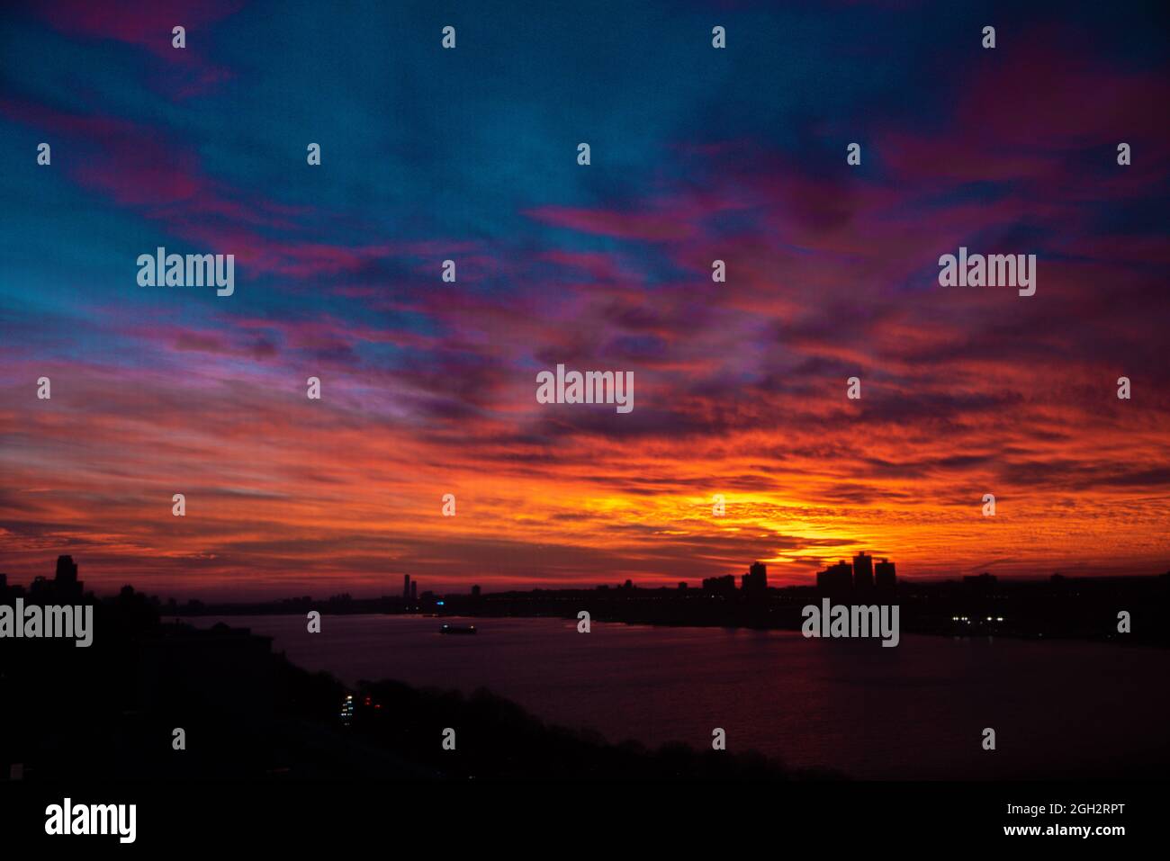 Sunset from an NYC window Stock Photo - Alamy