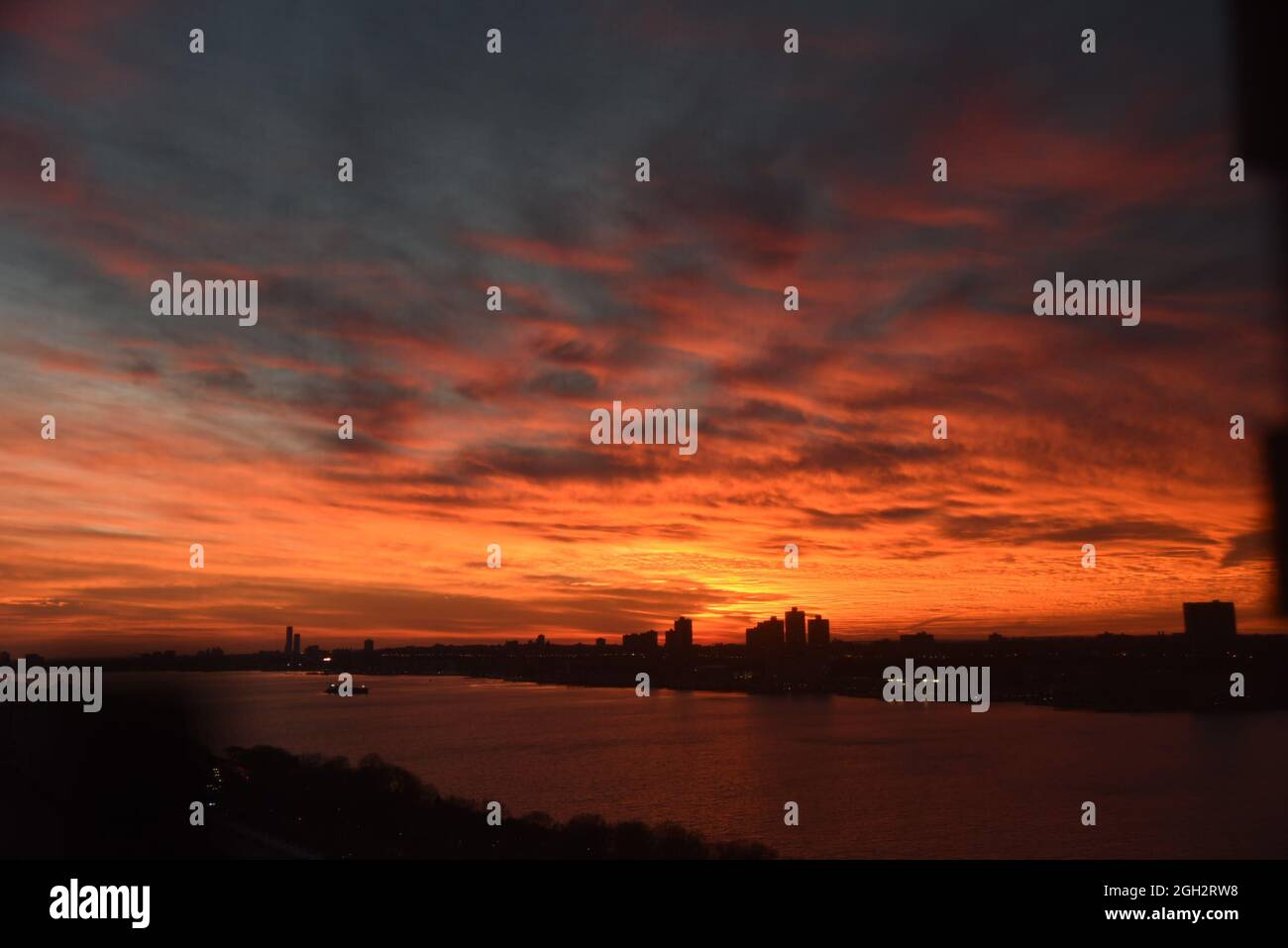 Sunset from an NYC window Stock Photo - Alamy