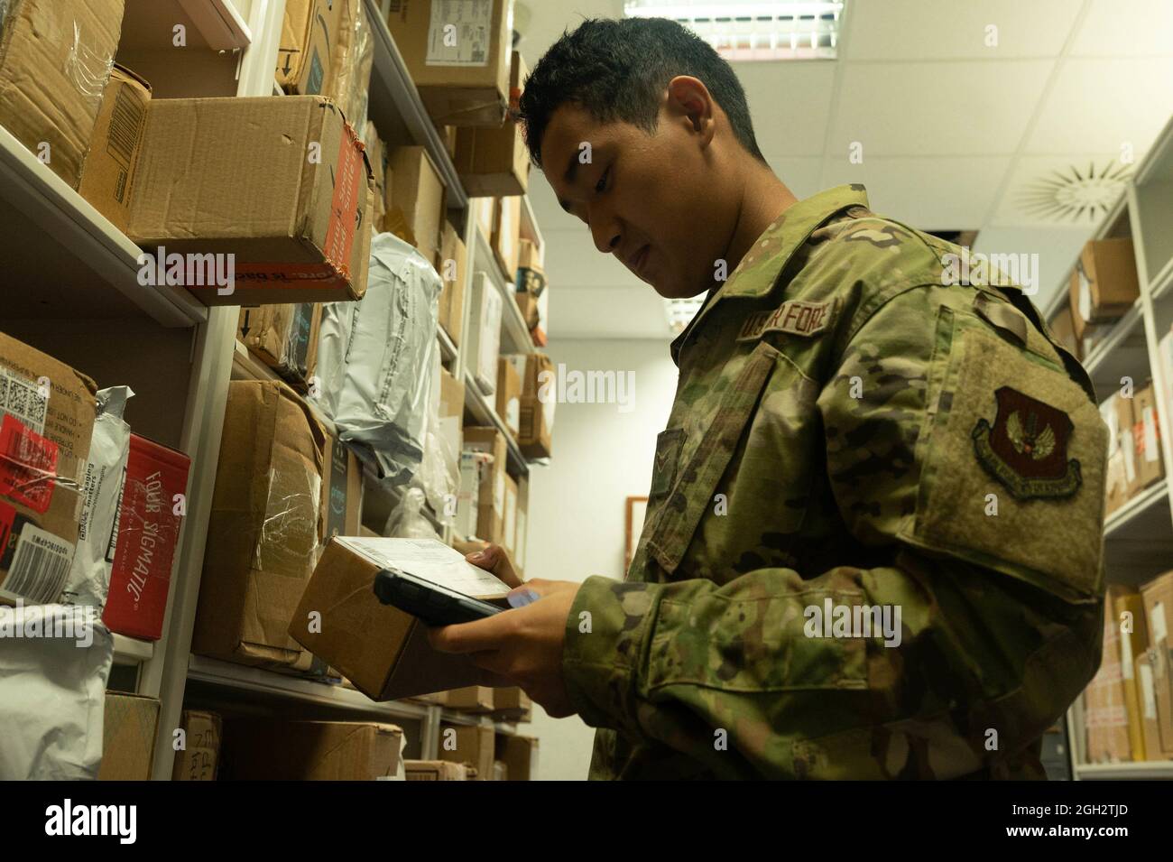 Airman Gustavo Garcia, 786th Force Support Squadron postal clerk, grabs ...