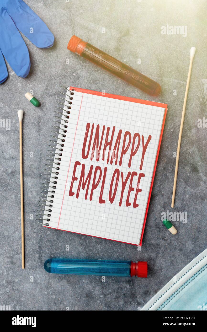 Hand writing sign Unhappy Employee. Word Written on a workforce not ...