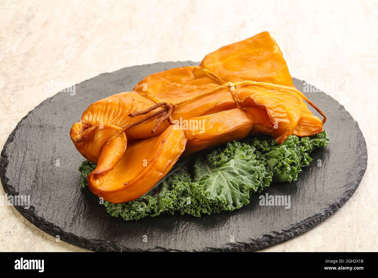 Smoked squid calamar appetizer snack isolated Stock Photo - Alamy